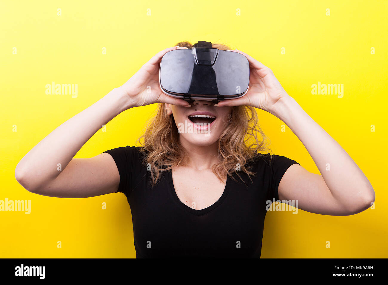 Woman with a VR virtual reality headset on her head Stock Photo - Alamy