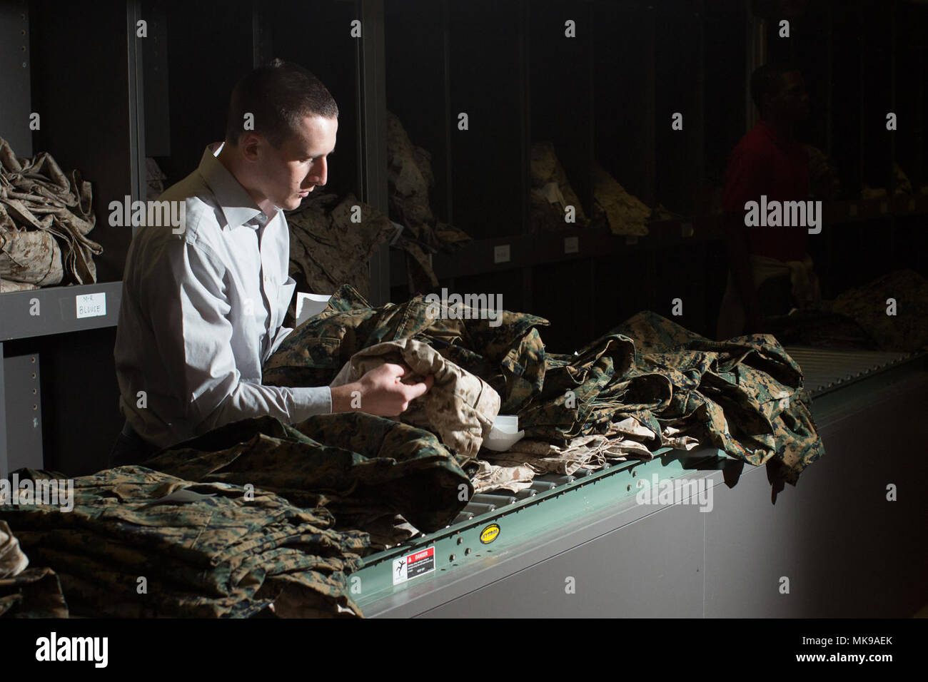 New recruits prepare uniforms to be handed out to other recruits in ...