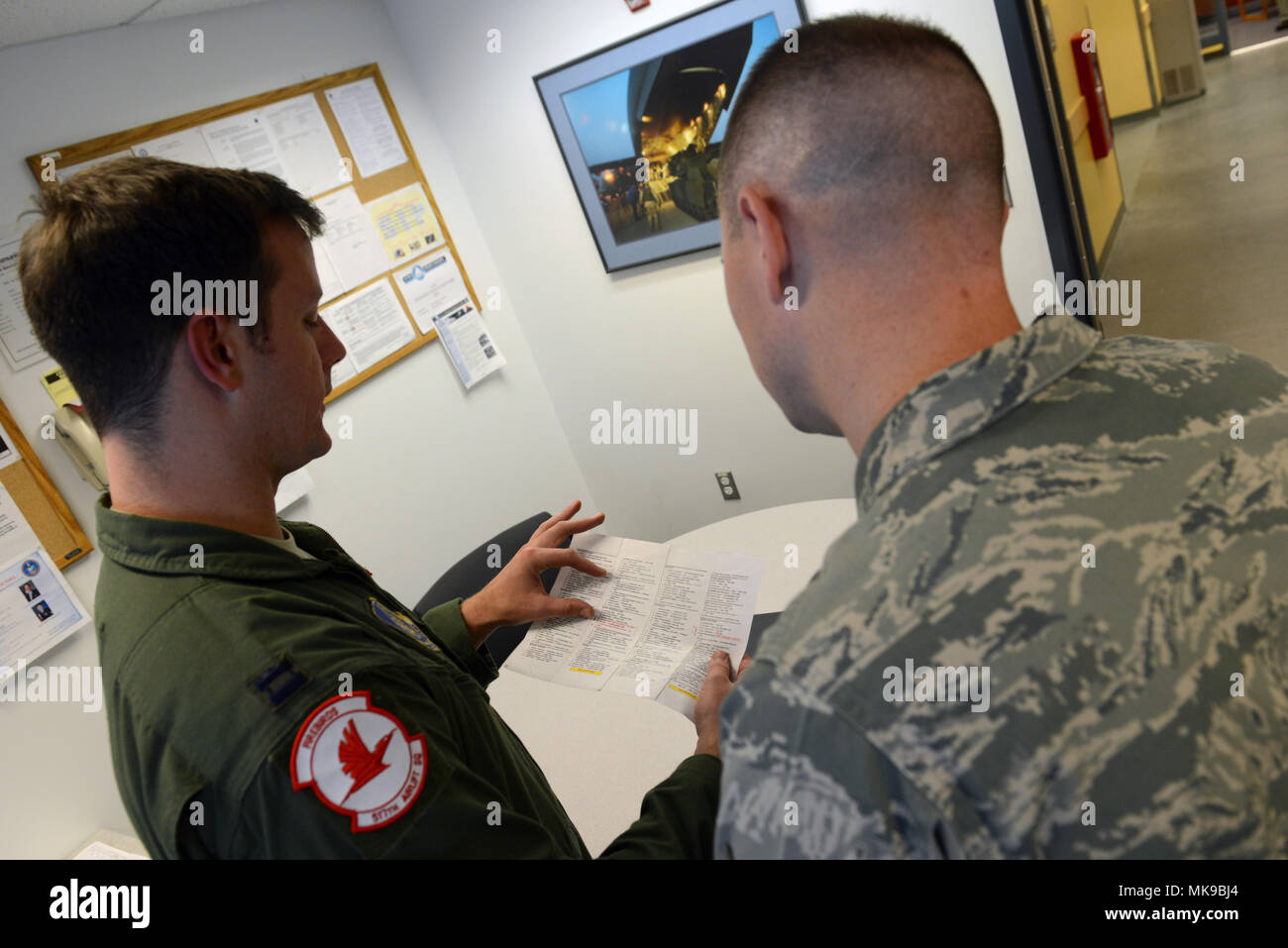 Air Force Capt. John Harris (left), 3rd Operations Support Squadron C ...
