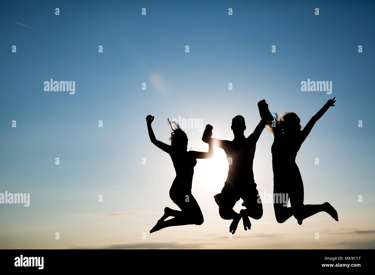 Women sunset jumping hi-res stock photography and images - Alamy
