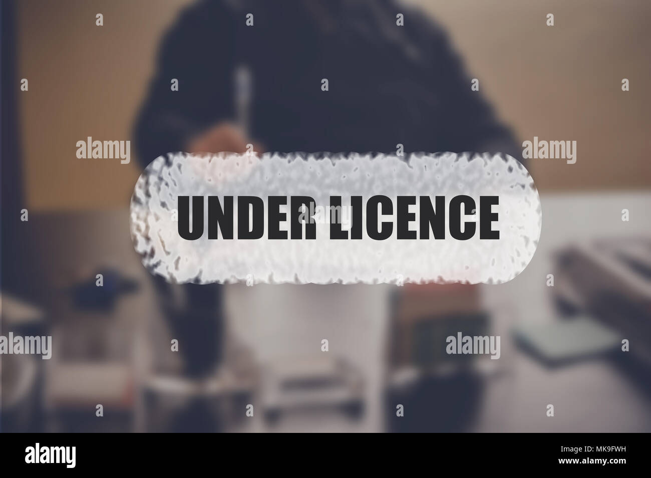 Under licence word with blurring business background Stock Photo - Alamy