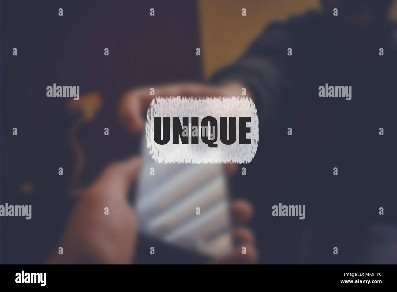 Unique word with blurring business background Stock Photo - Alamy