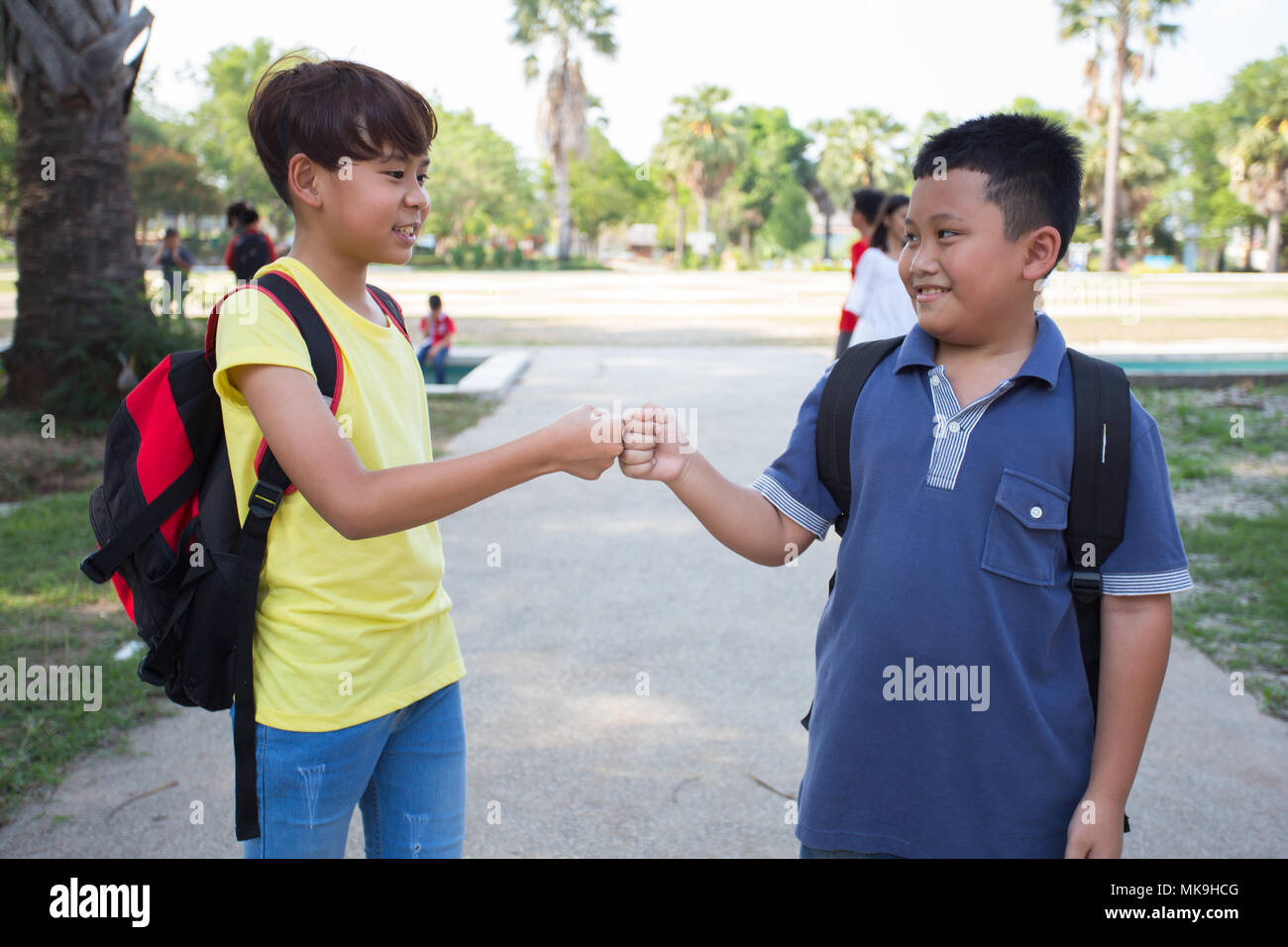A students are friends meeting and greating back to shcool at park of ...