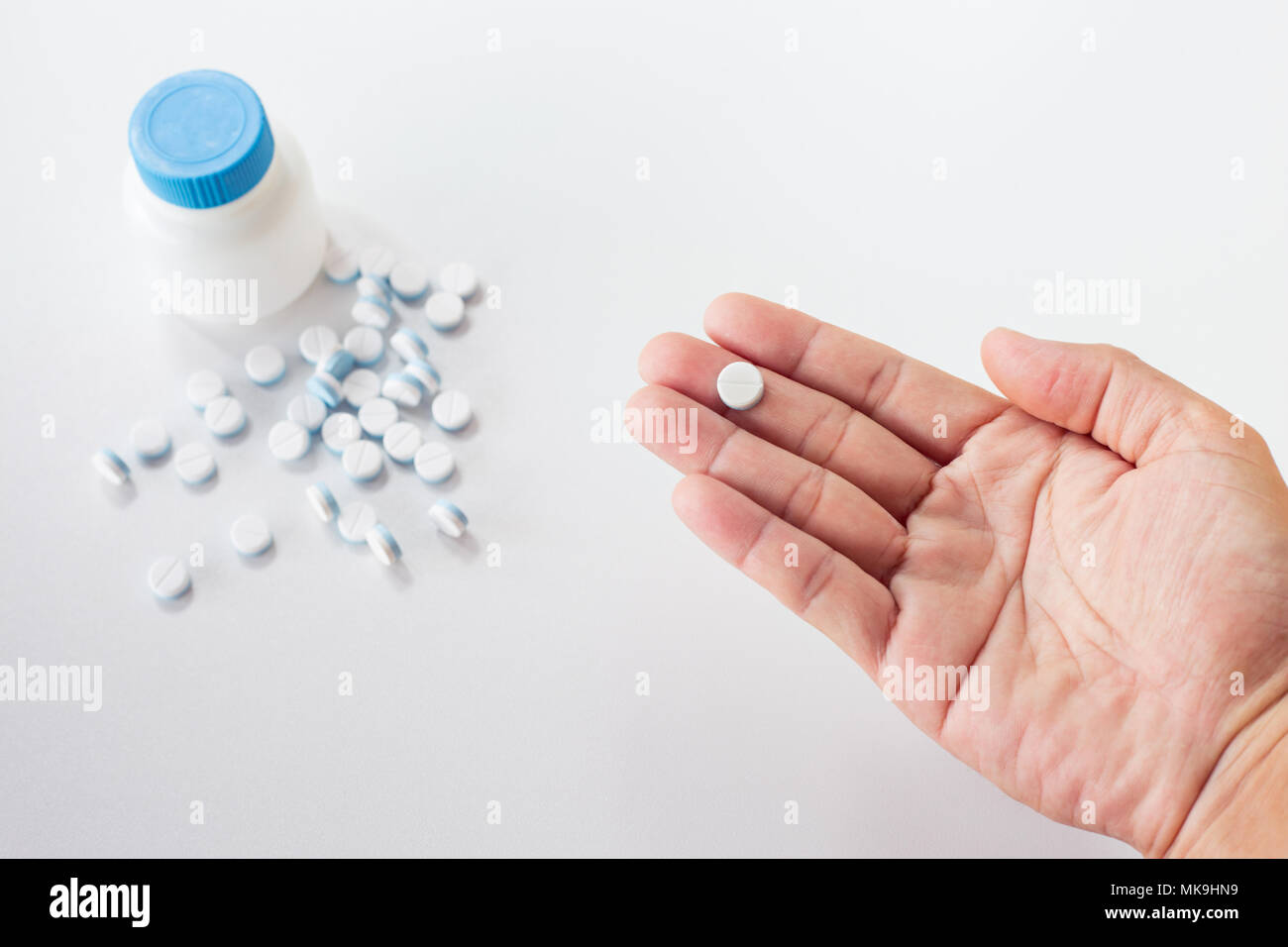 pills and medicines in the hand with medicines and pill on ground Stock ...