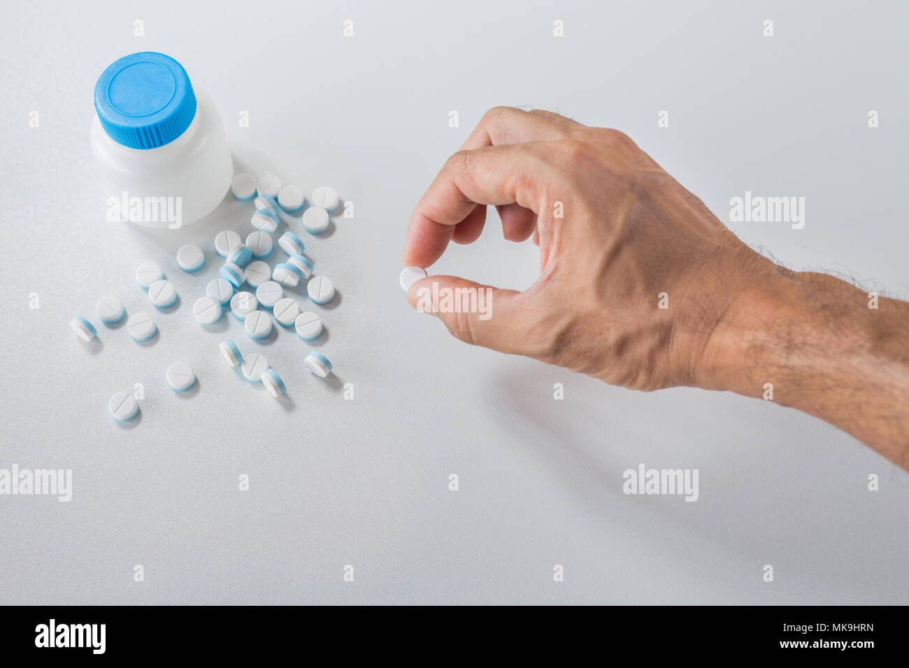pills and medicines in the hand with medicines and pill on ground Stock ...
