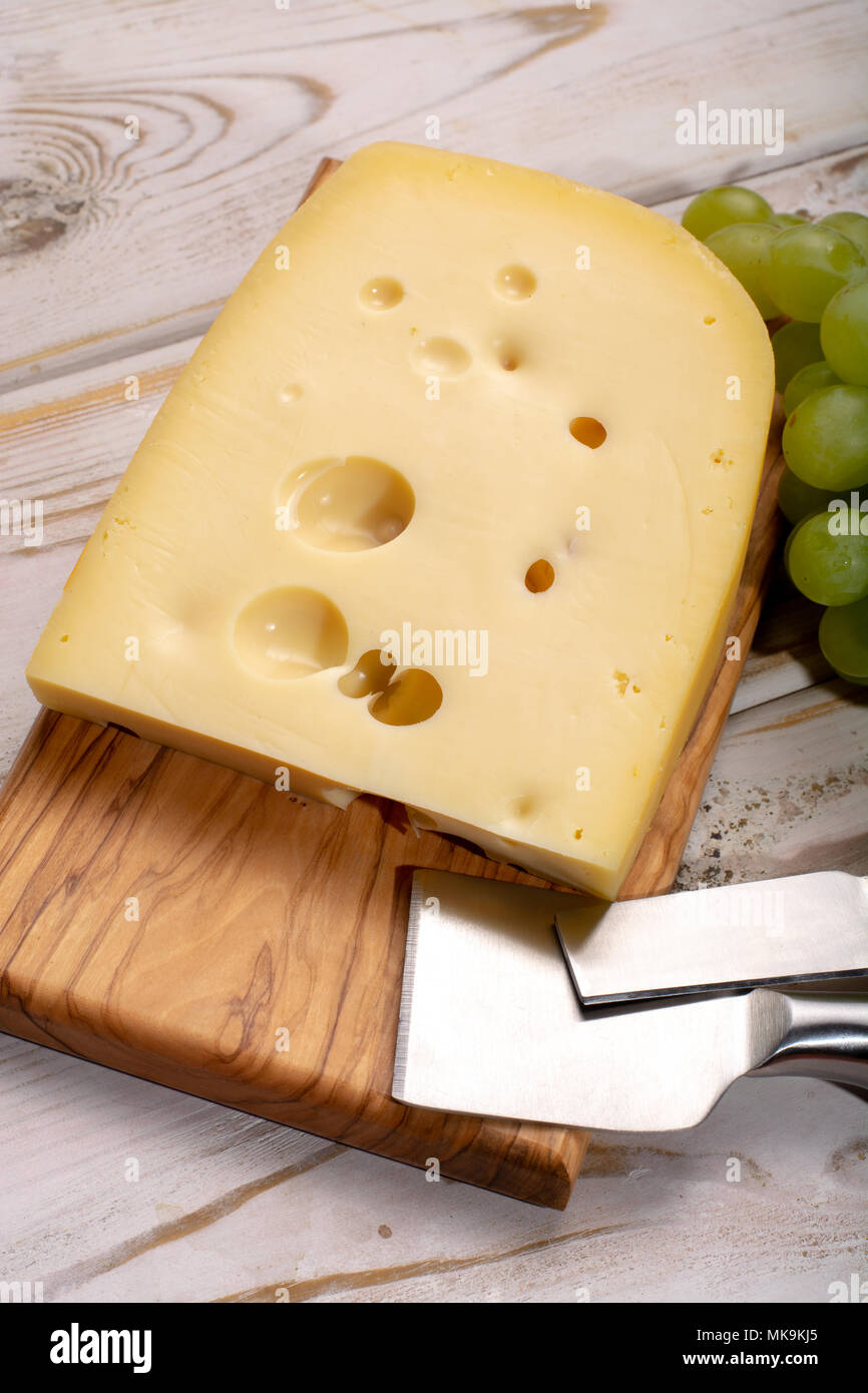 Dutch hard cheese Maasdam or Emmentaler, cheese with holes Stock Photo ...