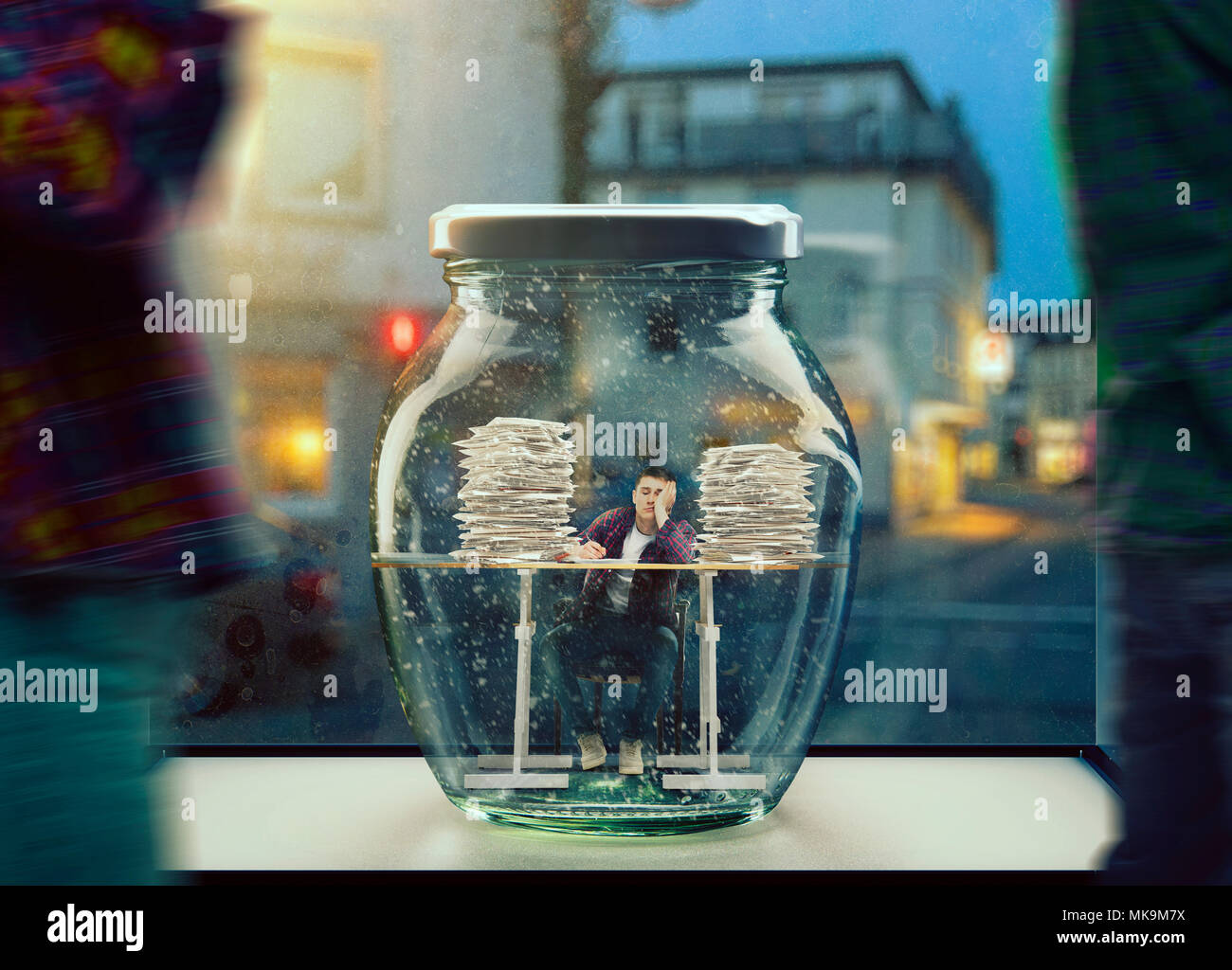 Loneliness concept, helpless sad man is sitting behind stacks of books ...