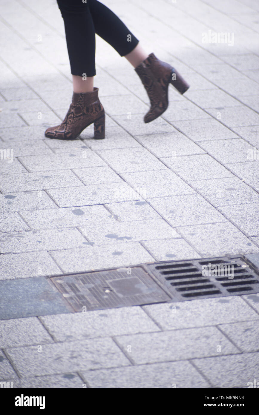 People walking in busy urban city shopping street sidewalk pavement ...