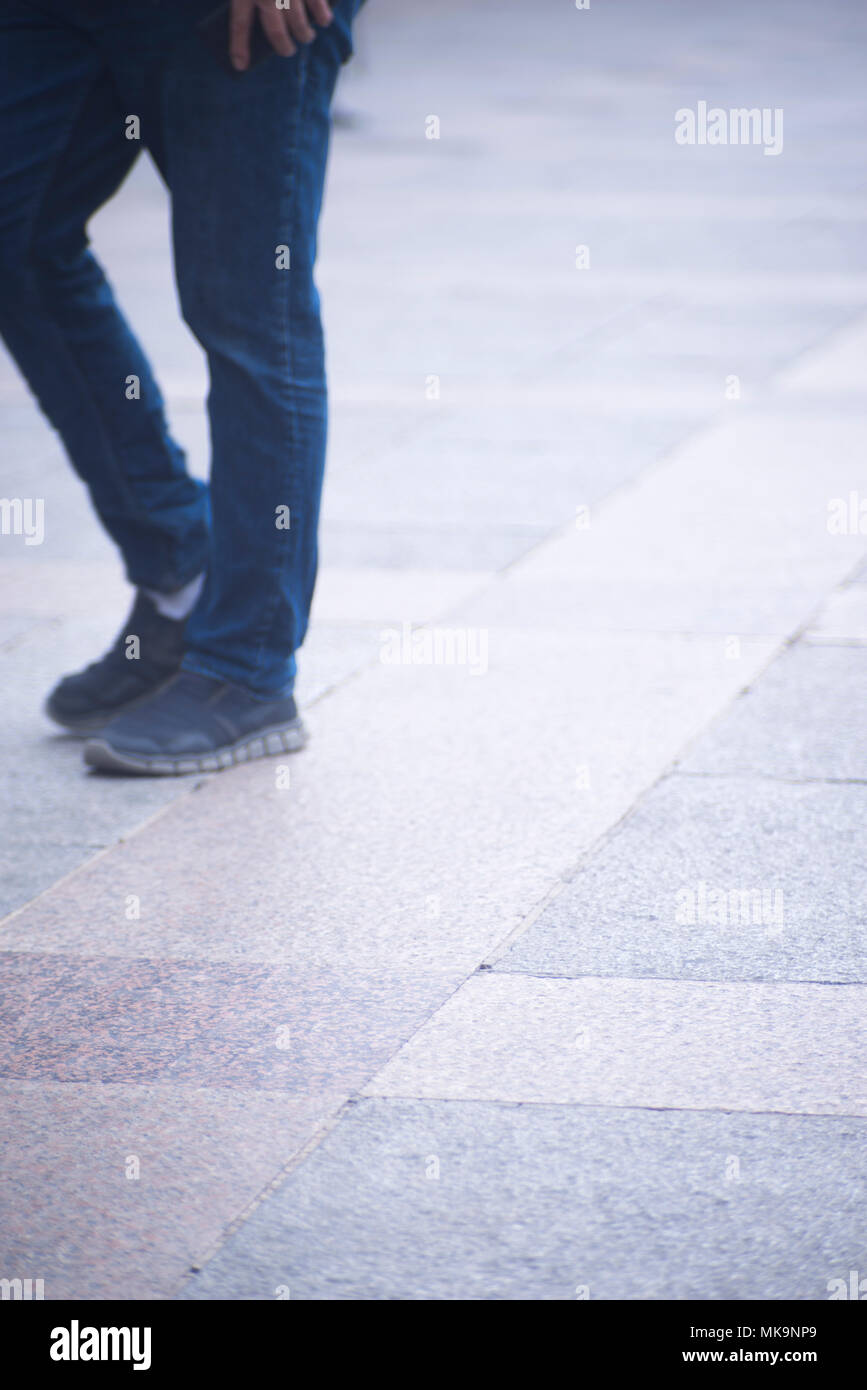 People walking in busy urban city shopping street sidewalk pavement ...