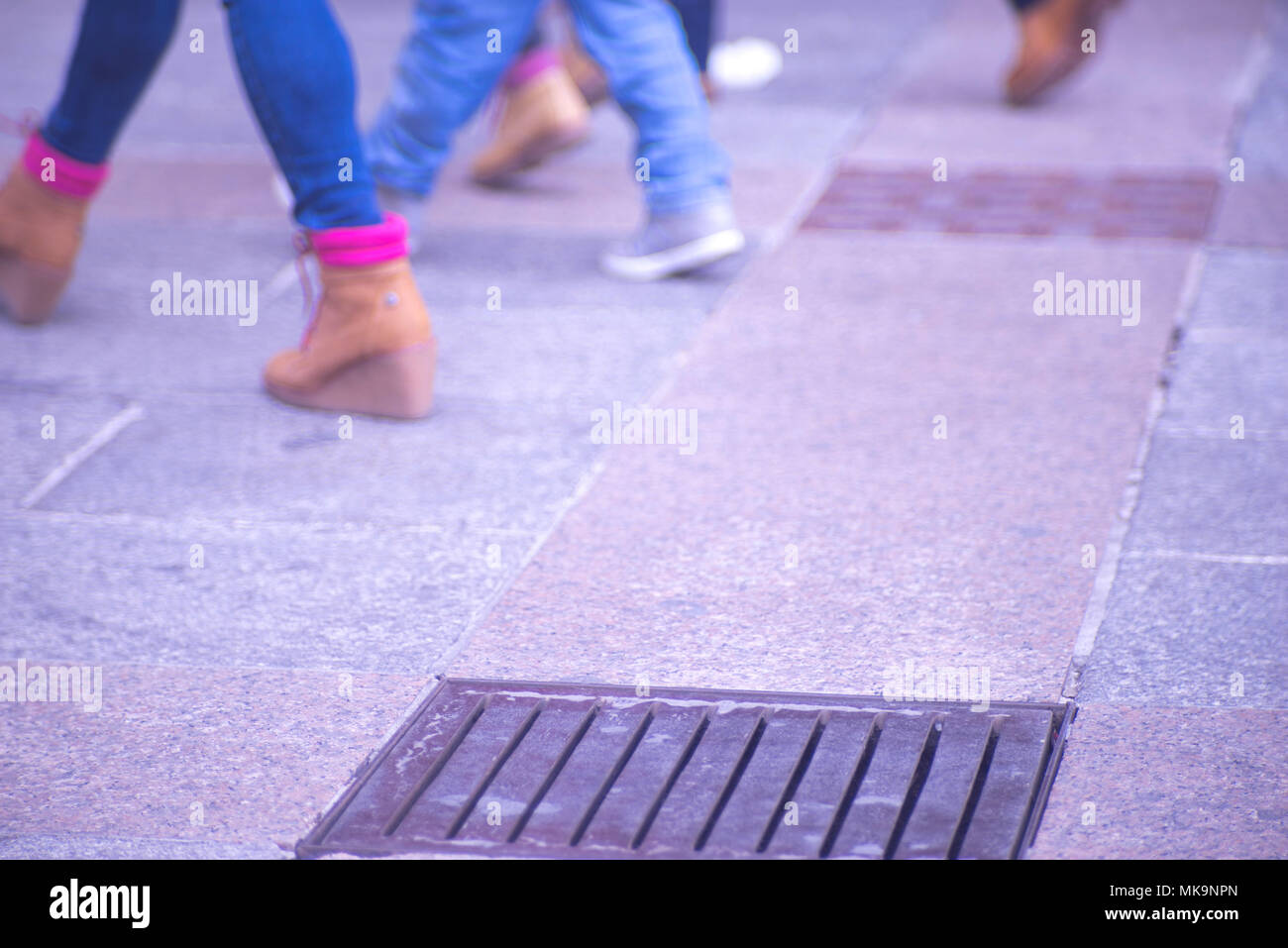 People walking in busy urban city shopping street sidewalk pavement ...