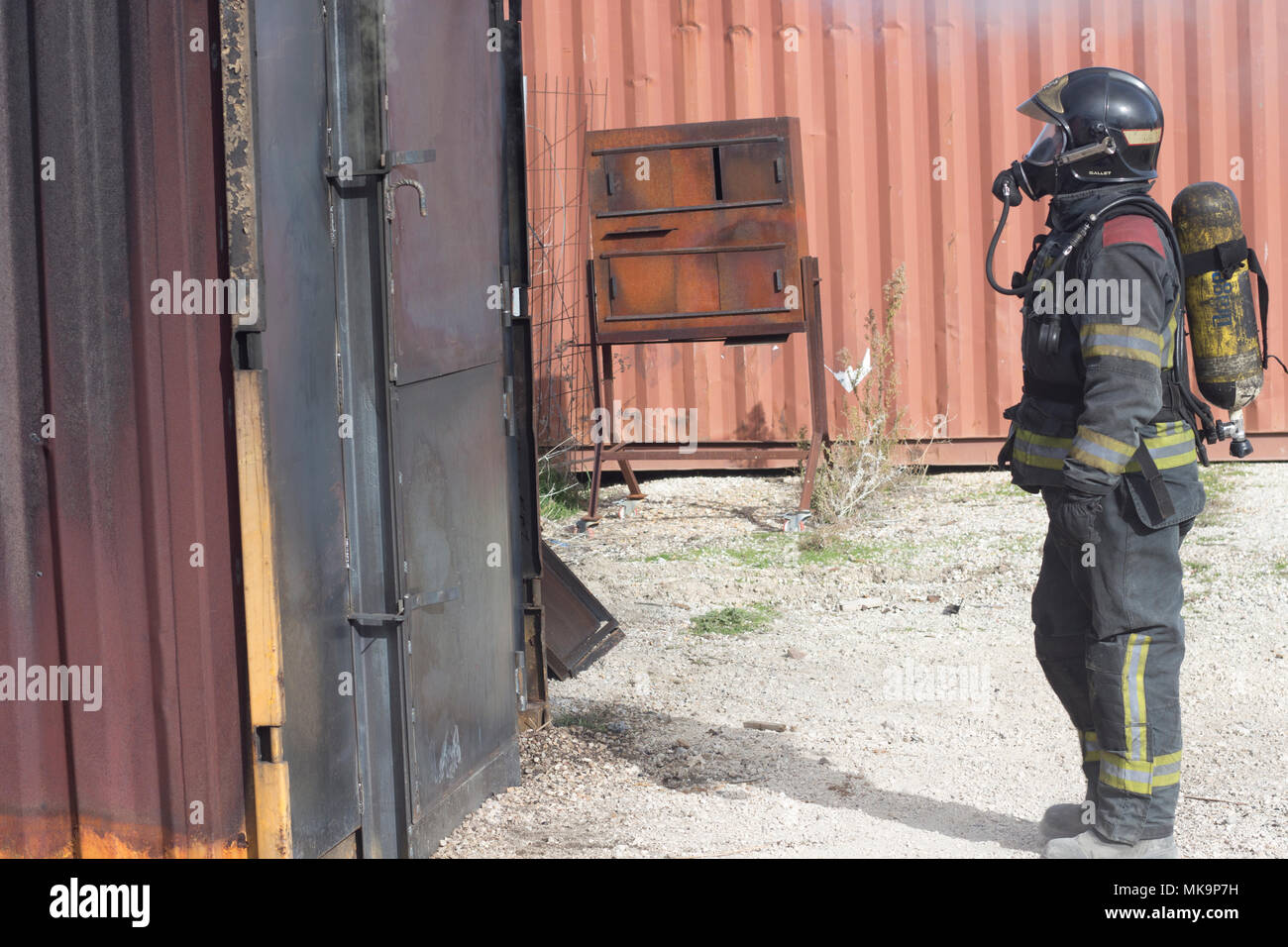 Firefighter putting out fire training station extinguisher backdraft ...