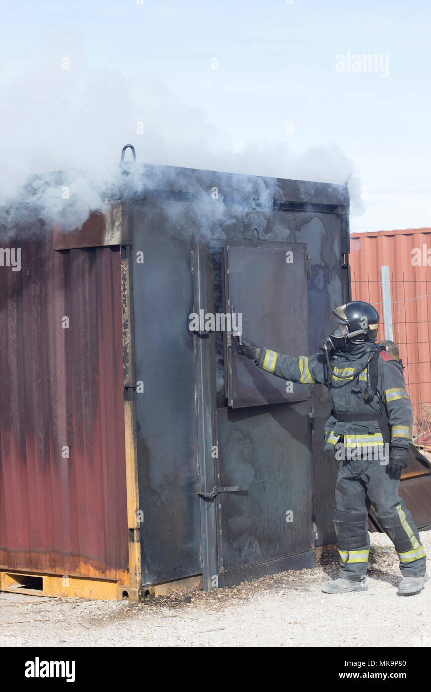 Firefighter putting out fire training station extinguisher backdraft ...