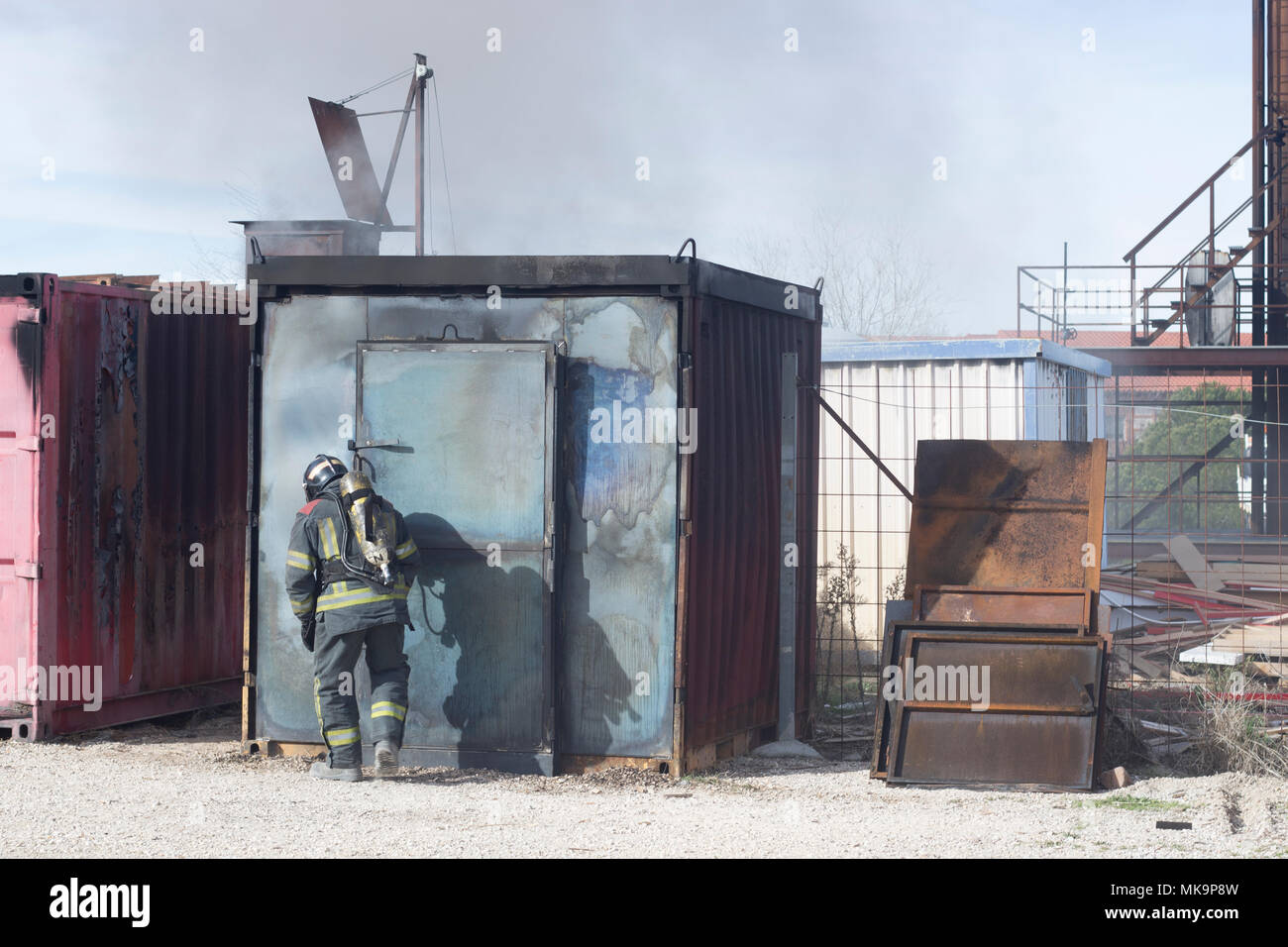 Firefighter putting out fire training station extinguisher backdraft ...