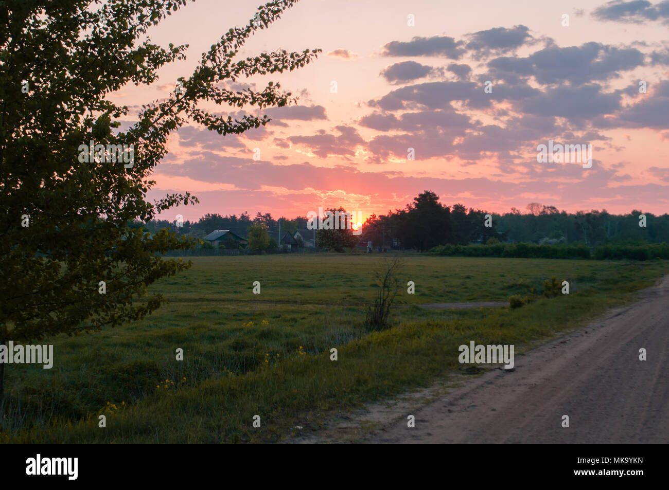 Sky with clouds at dawn over the morning village Stock Photo - Alamy