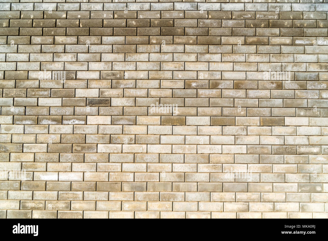 Beige bricks wall background Stock Photo - Alamy