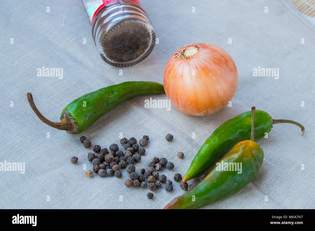 Spices. Burning peppers with onion on a linen kitchen cloth Stock Photo ...