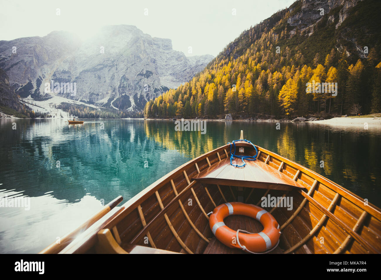 Beautiful view of traditional wooden rowing boat on scenic Lago di ...