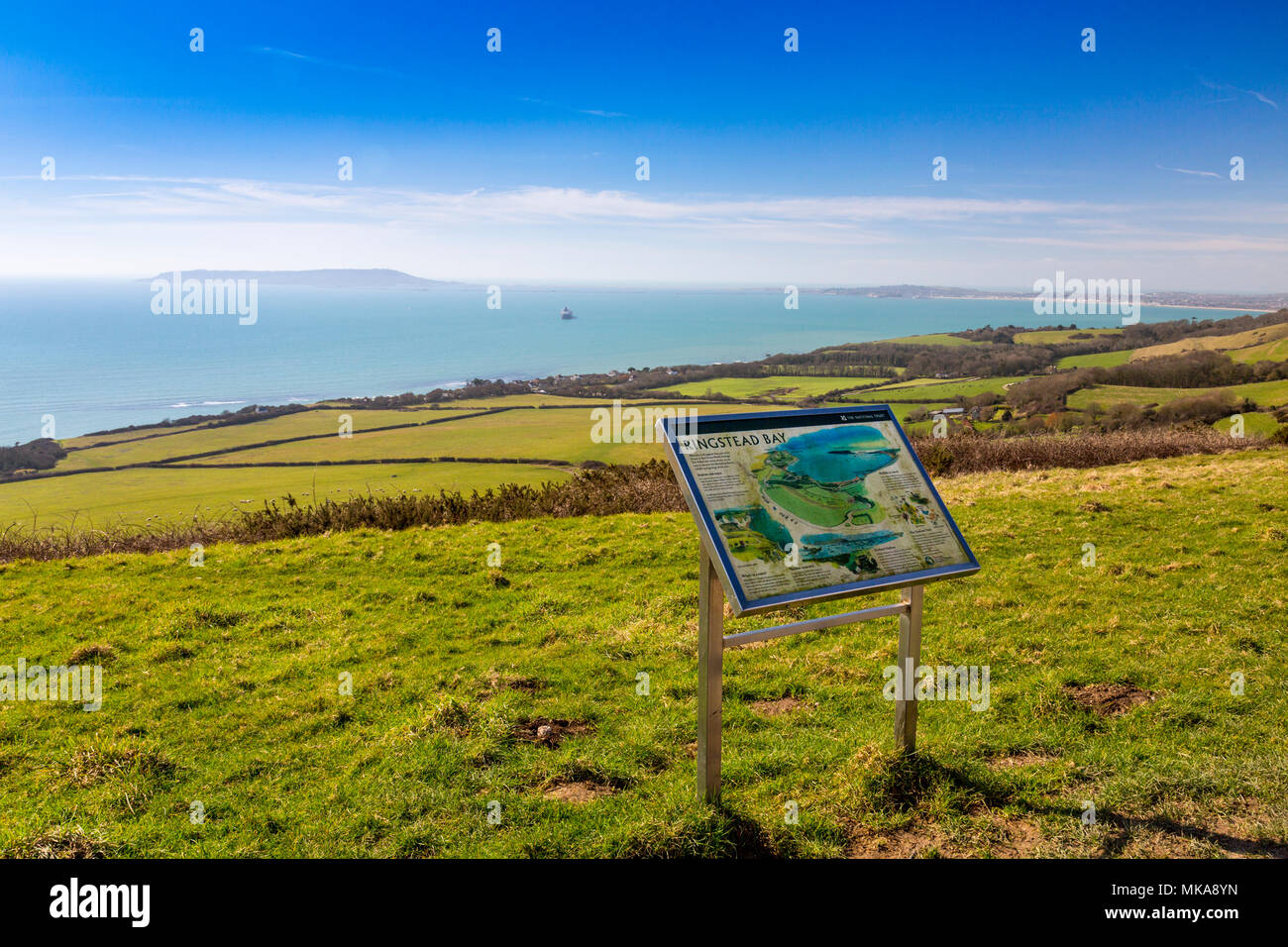Information board above Ringstead Bay with the Isle of Portland beyond ...