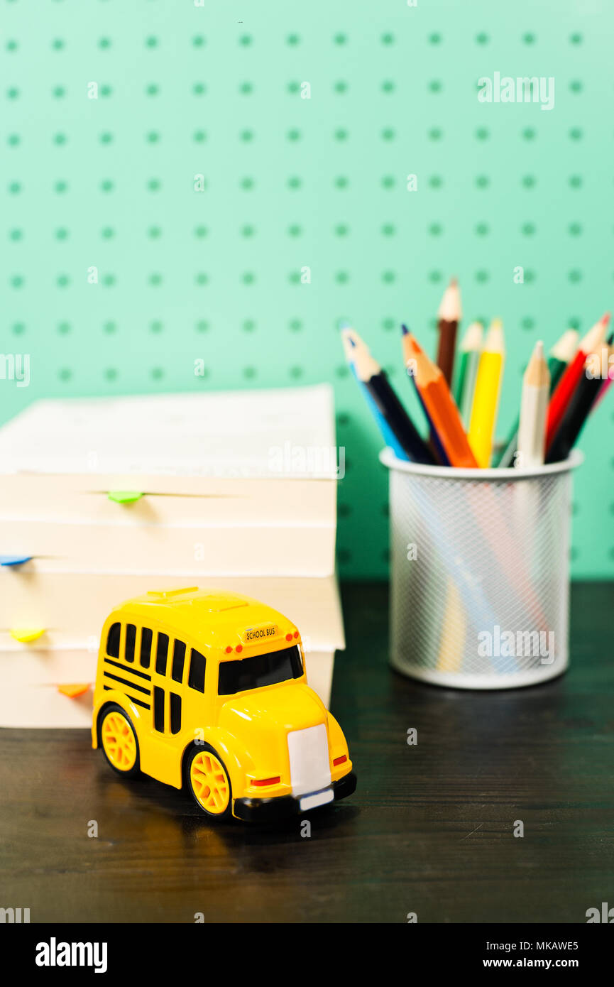 Back to school supplies pastel workspace with pencils, Books, toy ...