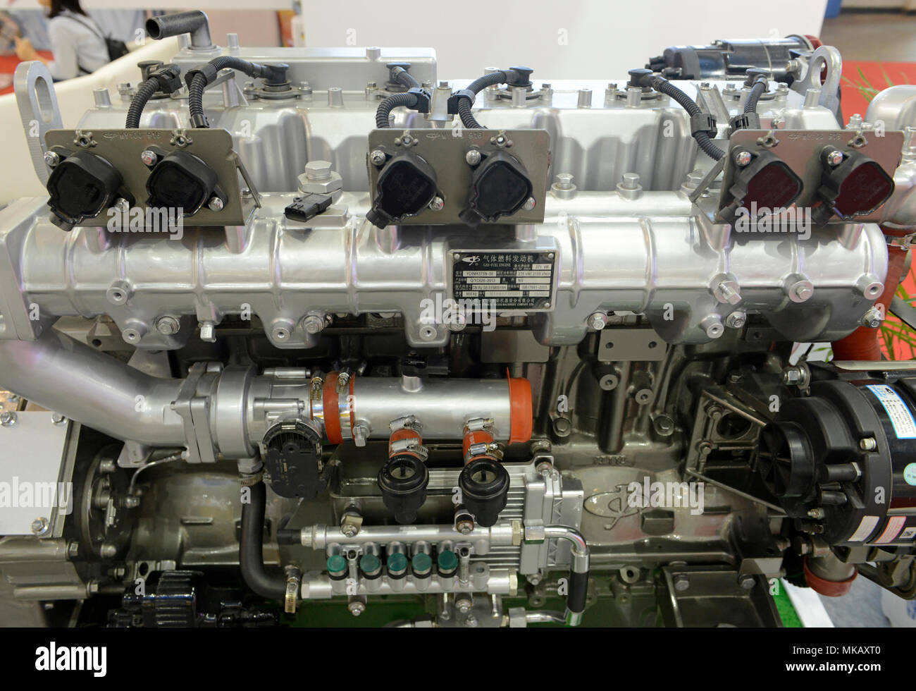 A gas-fueled engine on display at the Auto China 2018 motorshow in ...