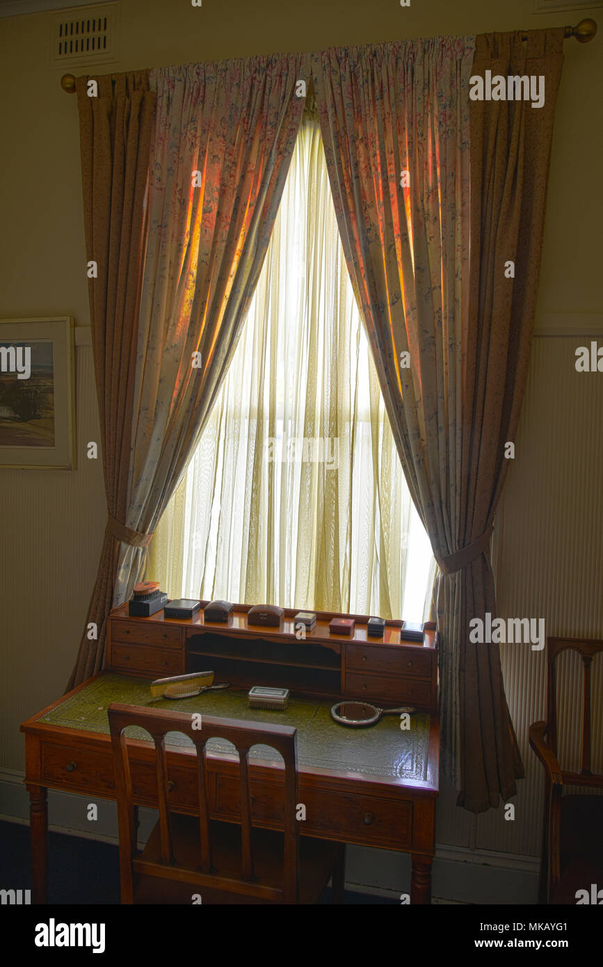 antique wooden desk at window with drawn curtains Stock Photo - Alamy
