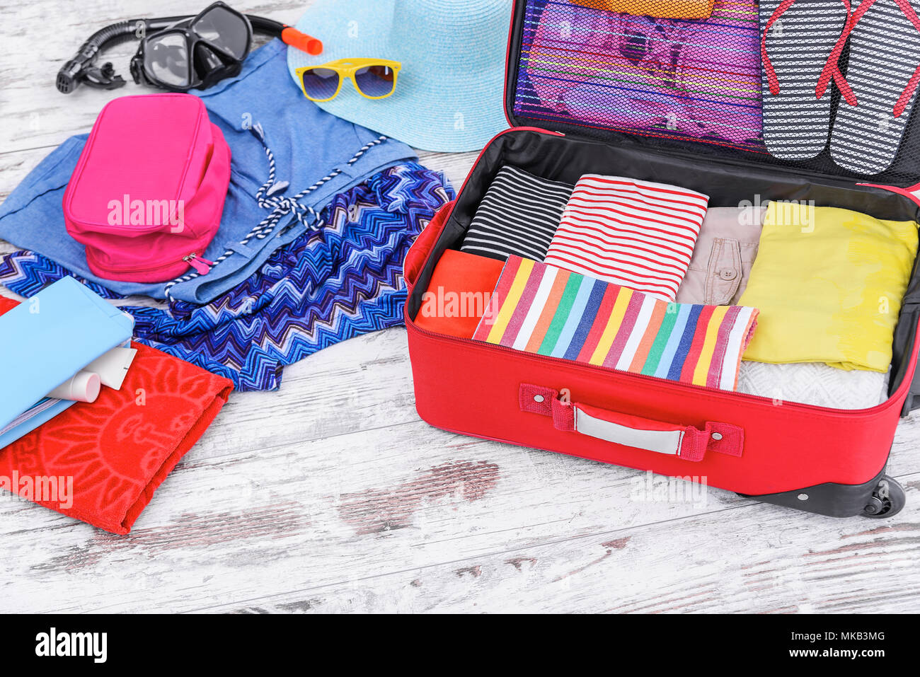Open suitcase packed hi-res stock photography and images - Alamy