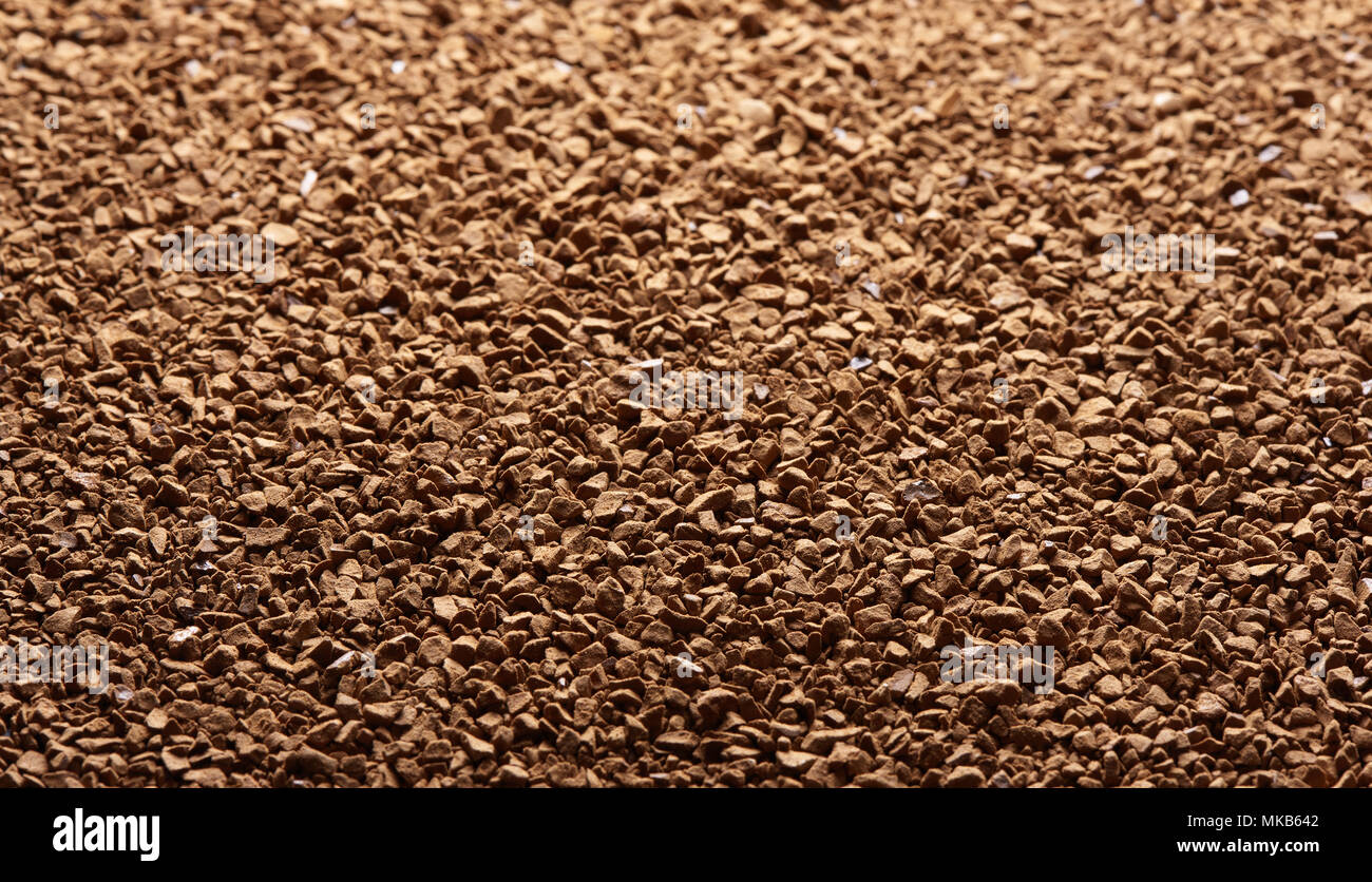 Granules of instant coffee background texture close up Stock Photo - Alamy