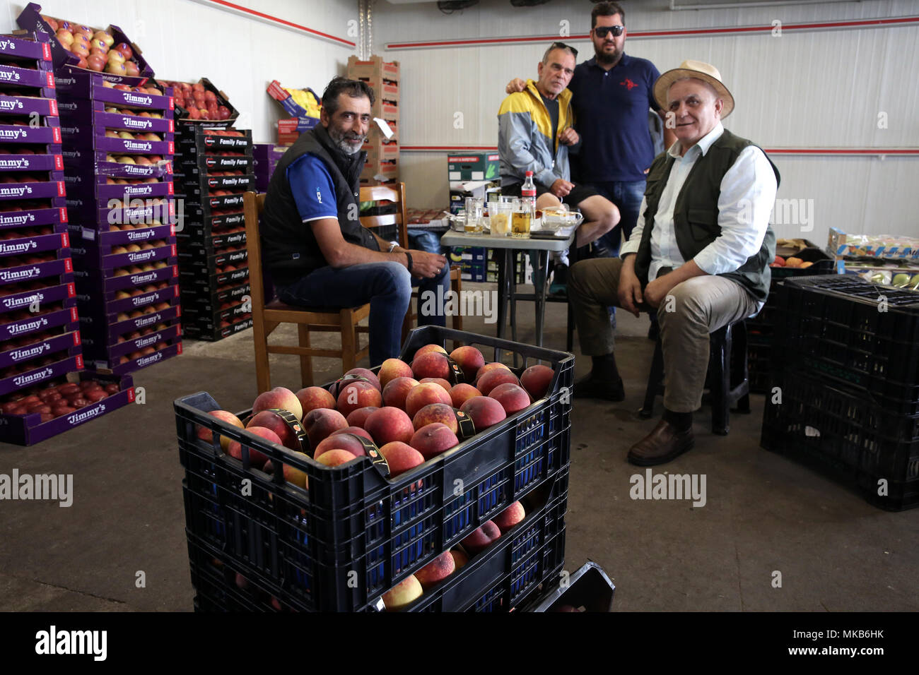 Workers and clients eat a meal during a break in the Fruit & Vegetable ...