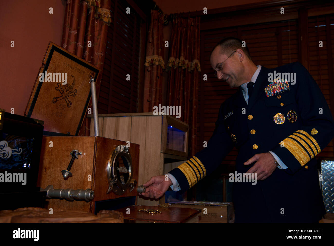 Coast Guard Vice Commandant Adm. Charles Michel looks at a hat box ...