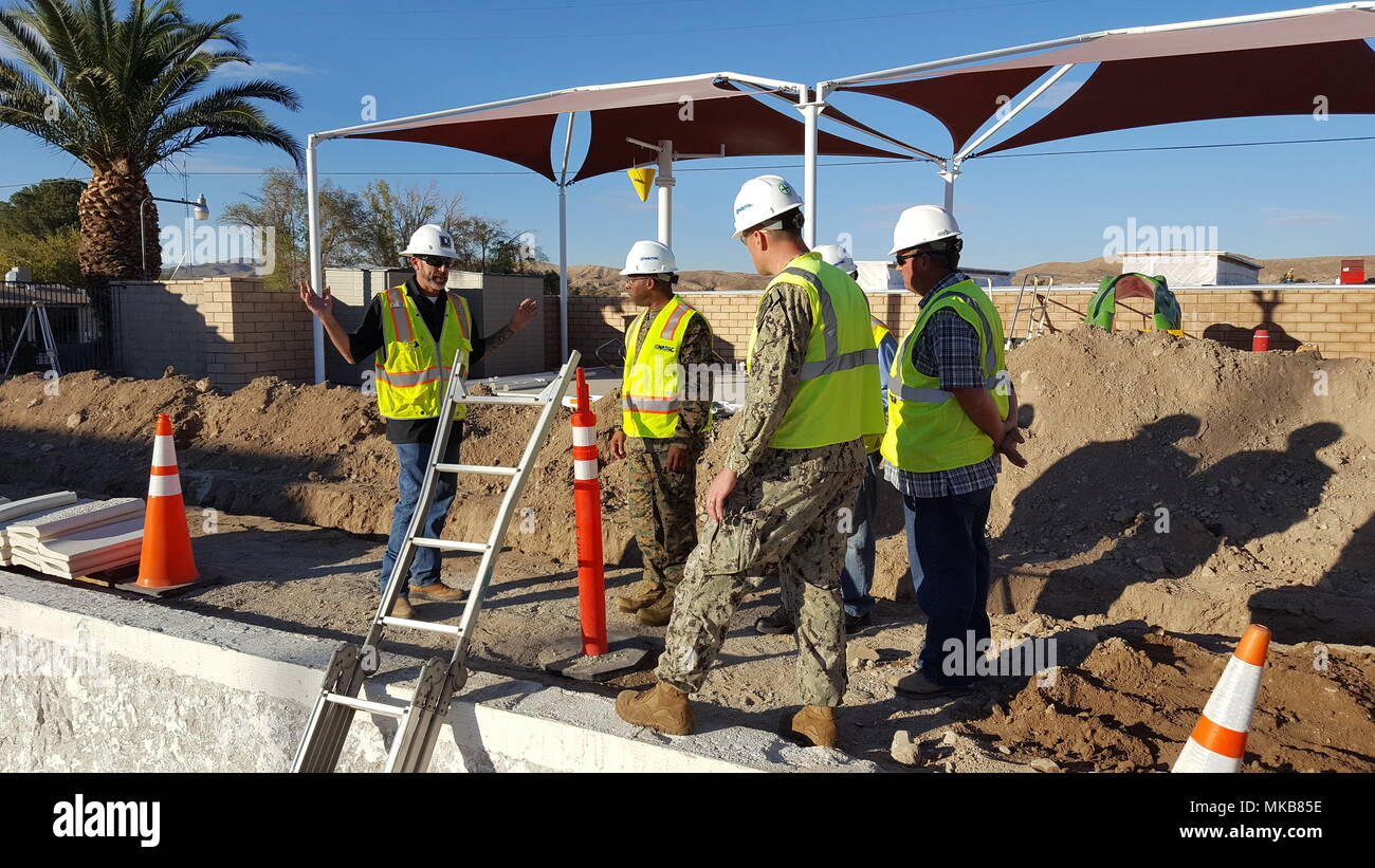 Colonel Sekou Karega, commander, MCLB Barstow, Calif., discusses the progress of the pool ...