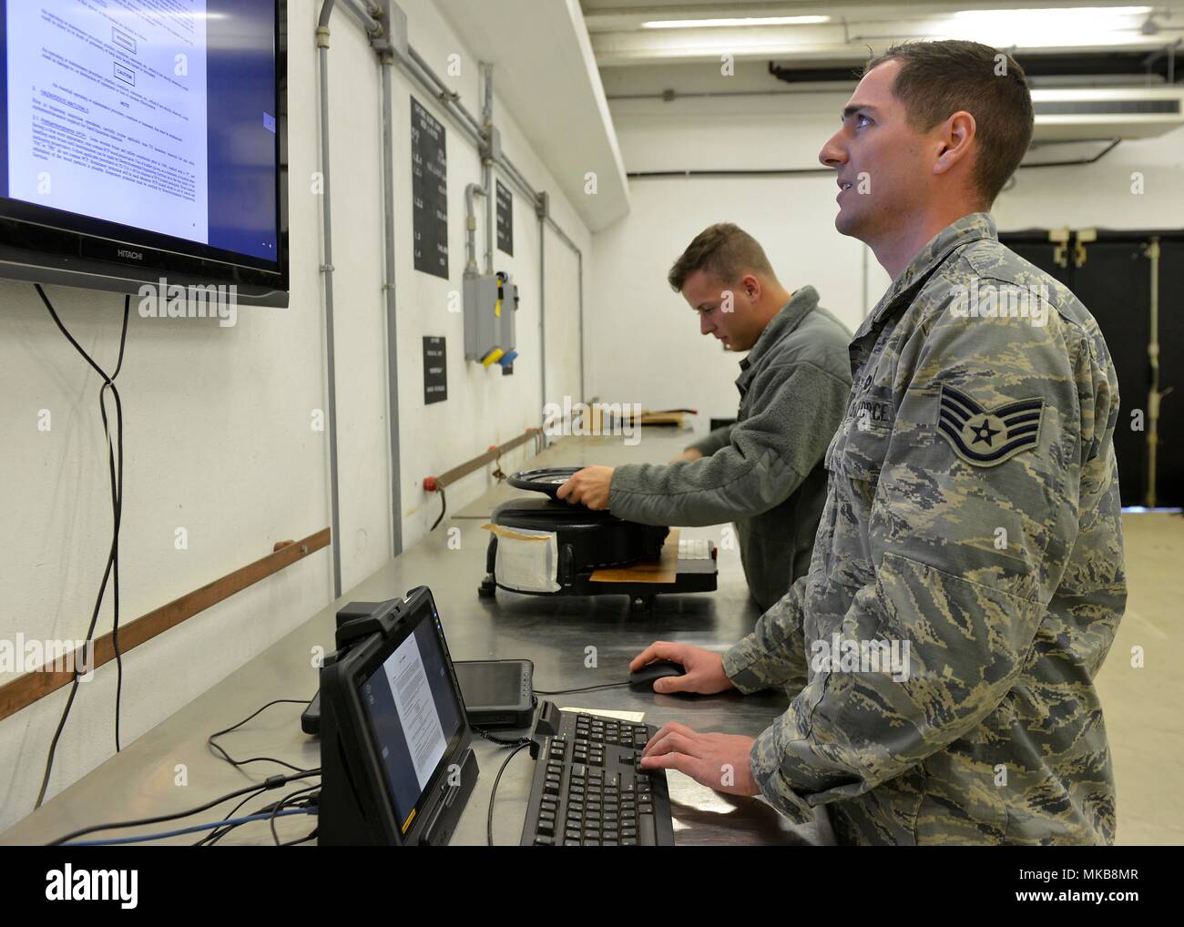 Staff Sgt. Trevor Harenza (right) and Staff Sgt. Eugene Eudy III (left ...