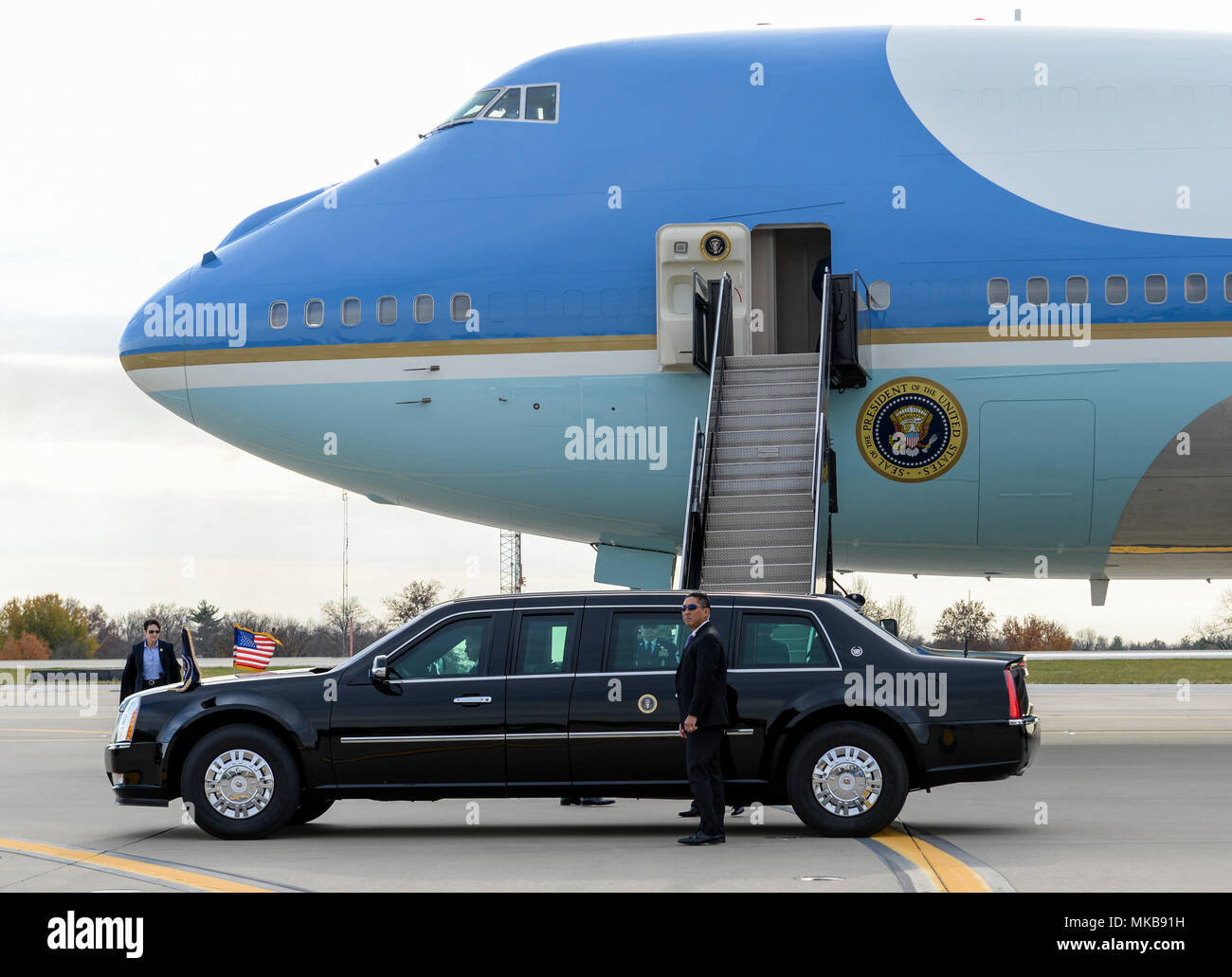 A driver parks The U.S. presidential limousine outside of Air Force 1 ...