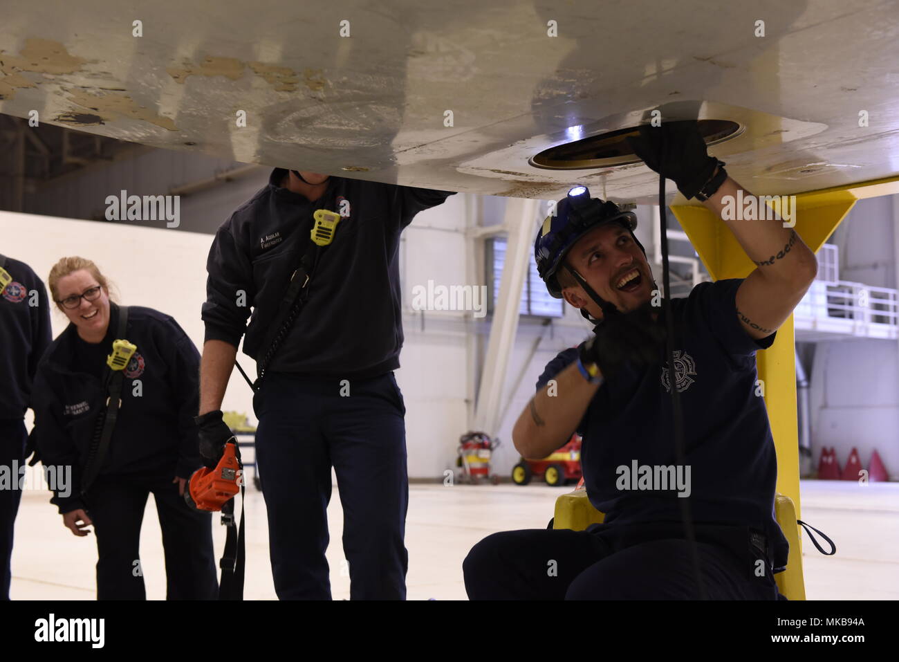 92nd Civil Engineering Squadron Firefighters take turns climbing into a ...