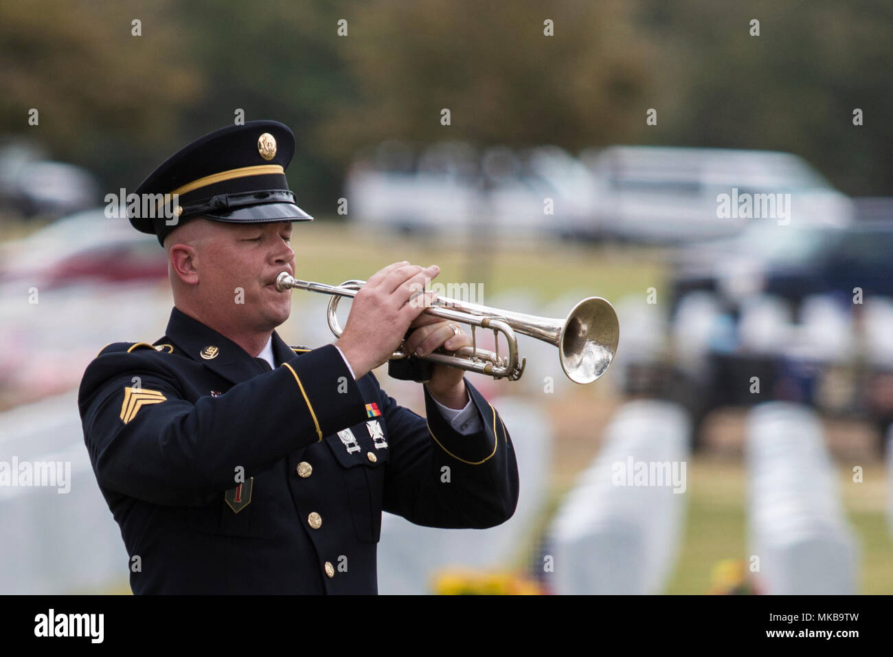 A Soldier plays taps during Retired Gen. Richard E. Cavazos’ internment ...