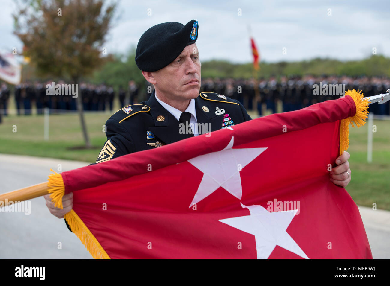 A soldier cases a four star flag during Retired Gen. Richard E. Cavazos ...