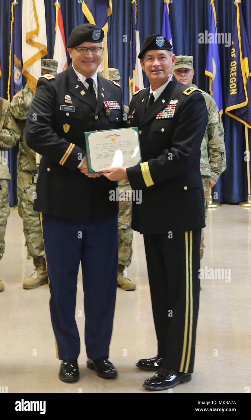 Retiree Col. John Vernick is congratulated with The Meritorious Service ...