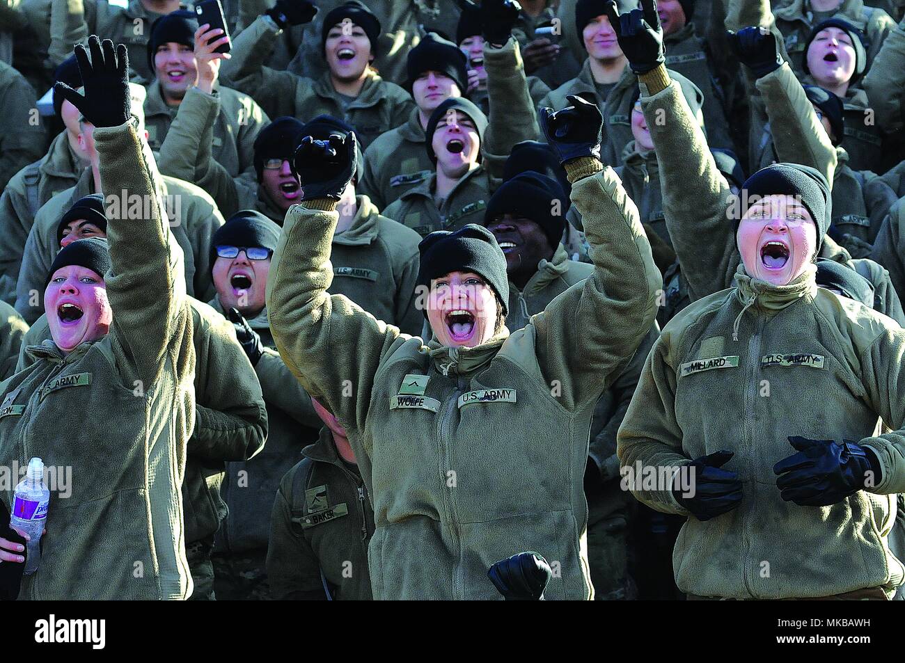 Pvt. Kayla Wolfe (center) and her battle buddies cheer for units ...