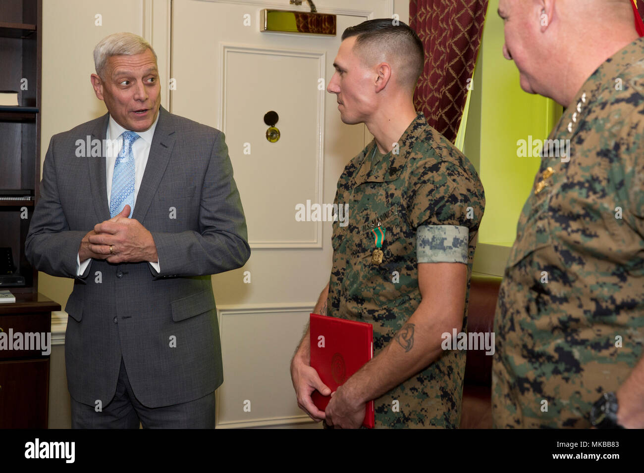 U.S. Marine Corps Gen. John M. Paxton Jr., retired, left, speaks during ...