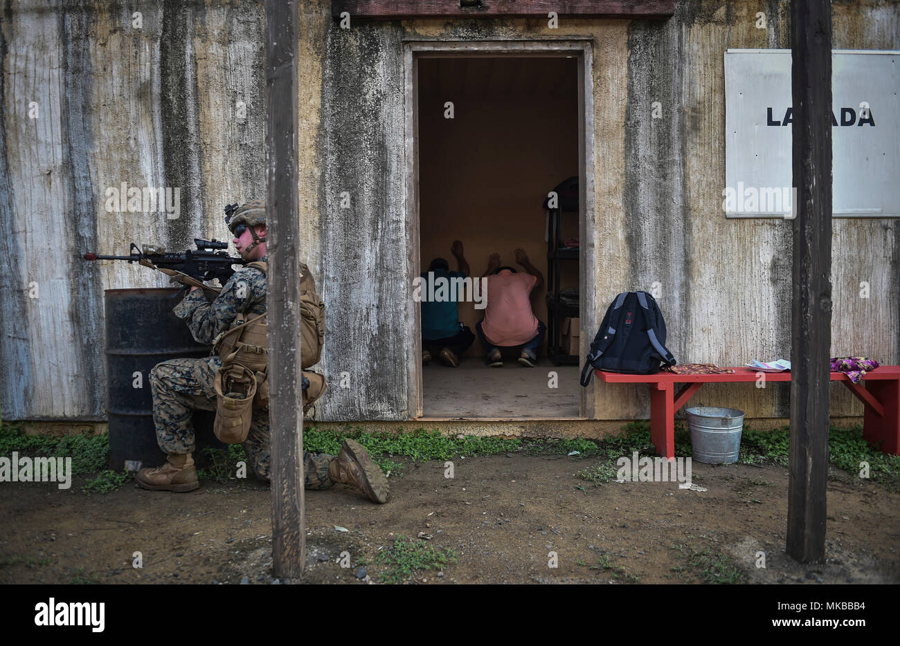 A Marine with 3rd Battalion, 3rd Marines maintains security for a ...