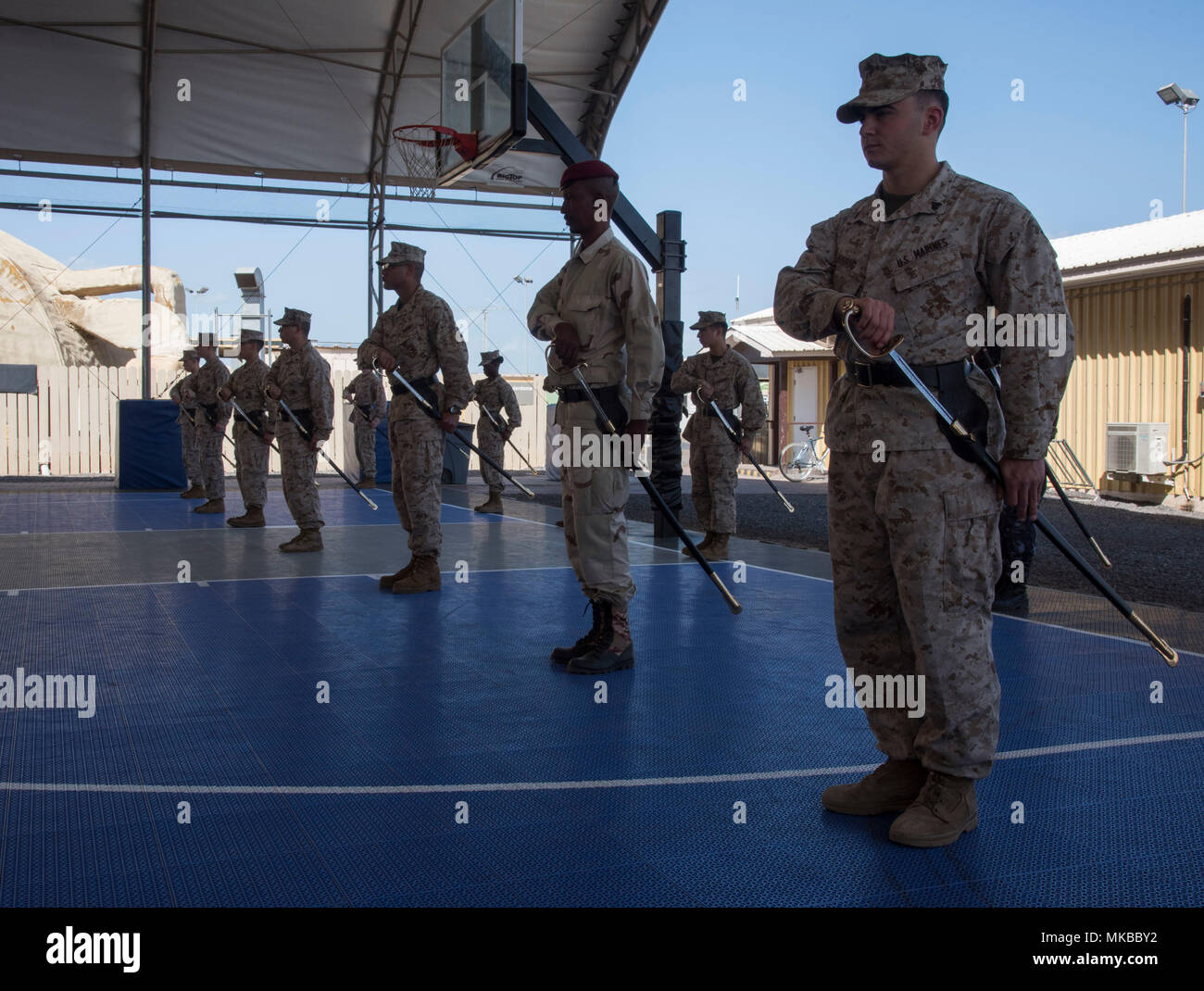 U.S. Marines and Djiboutian military members prepare for the order to ...