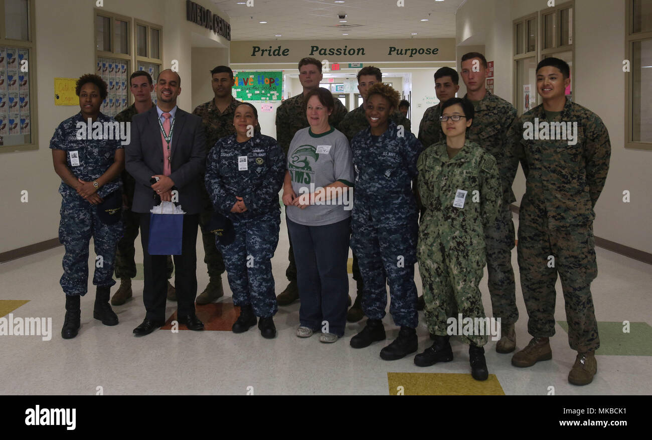 U.S. Marines and Sailors pose for a photo at Glades Middle School ...