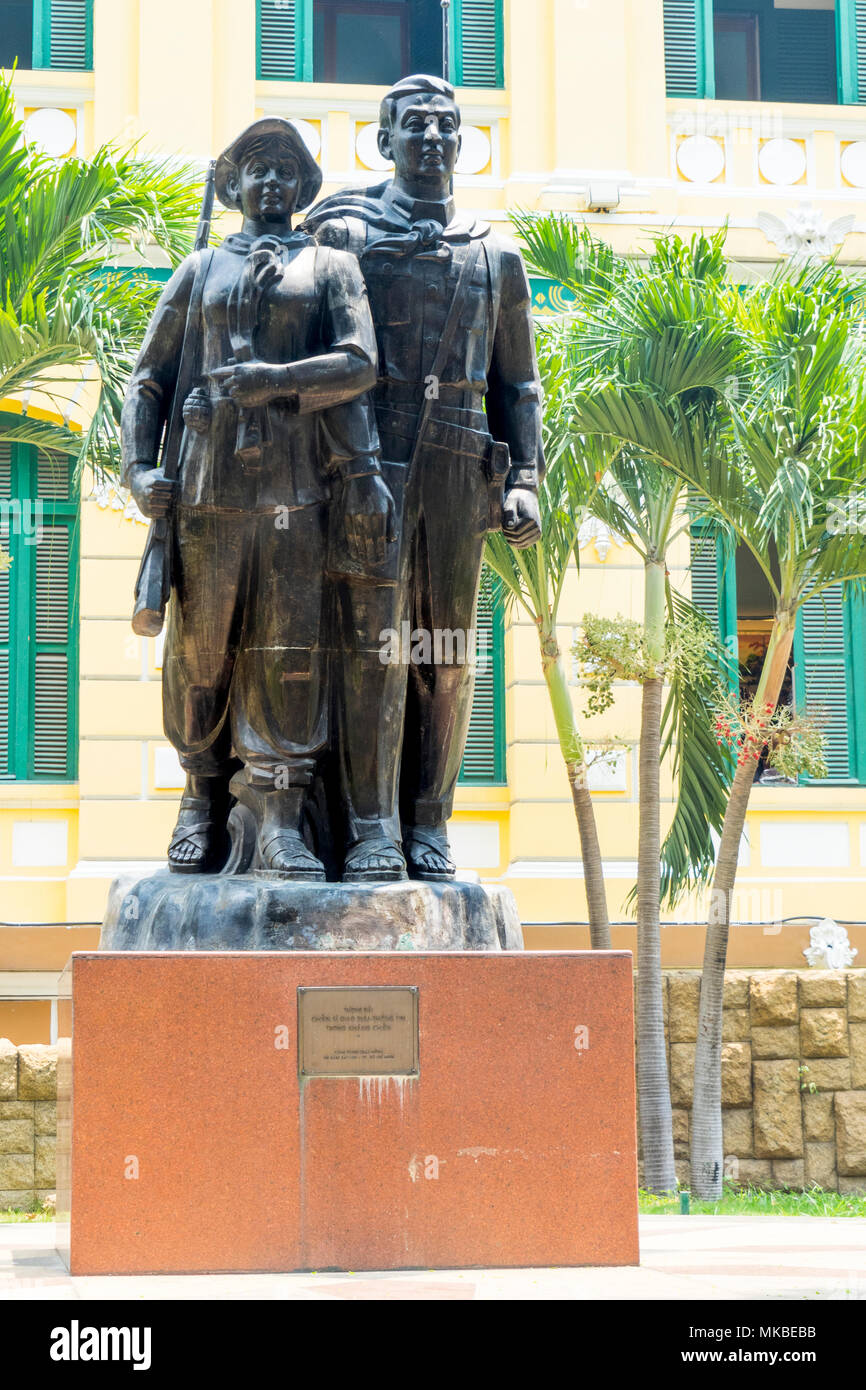 A monument of a bronze statue of two soldiers honouring the fallen in ...