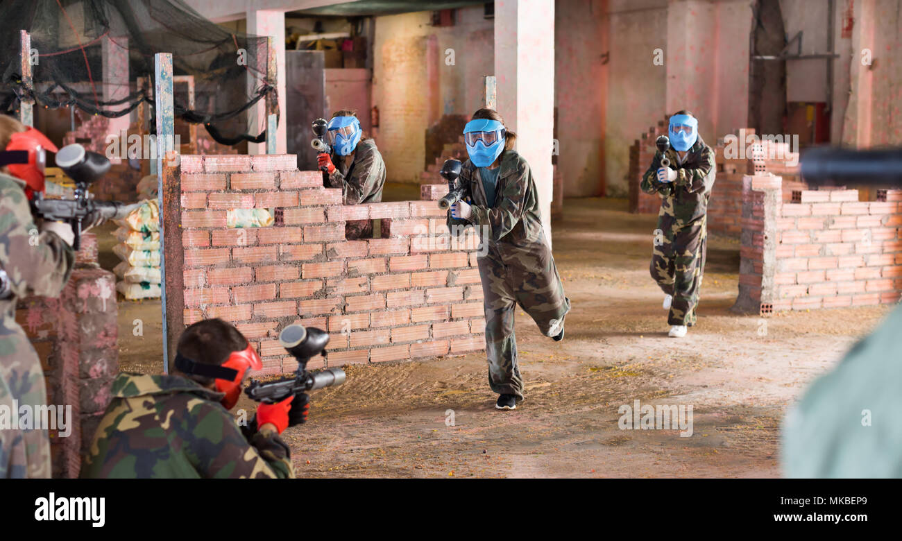 Teams are face to face in game on a paintball ground Stock Photo - Alamy