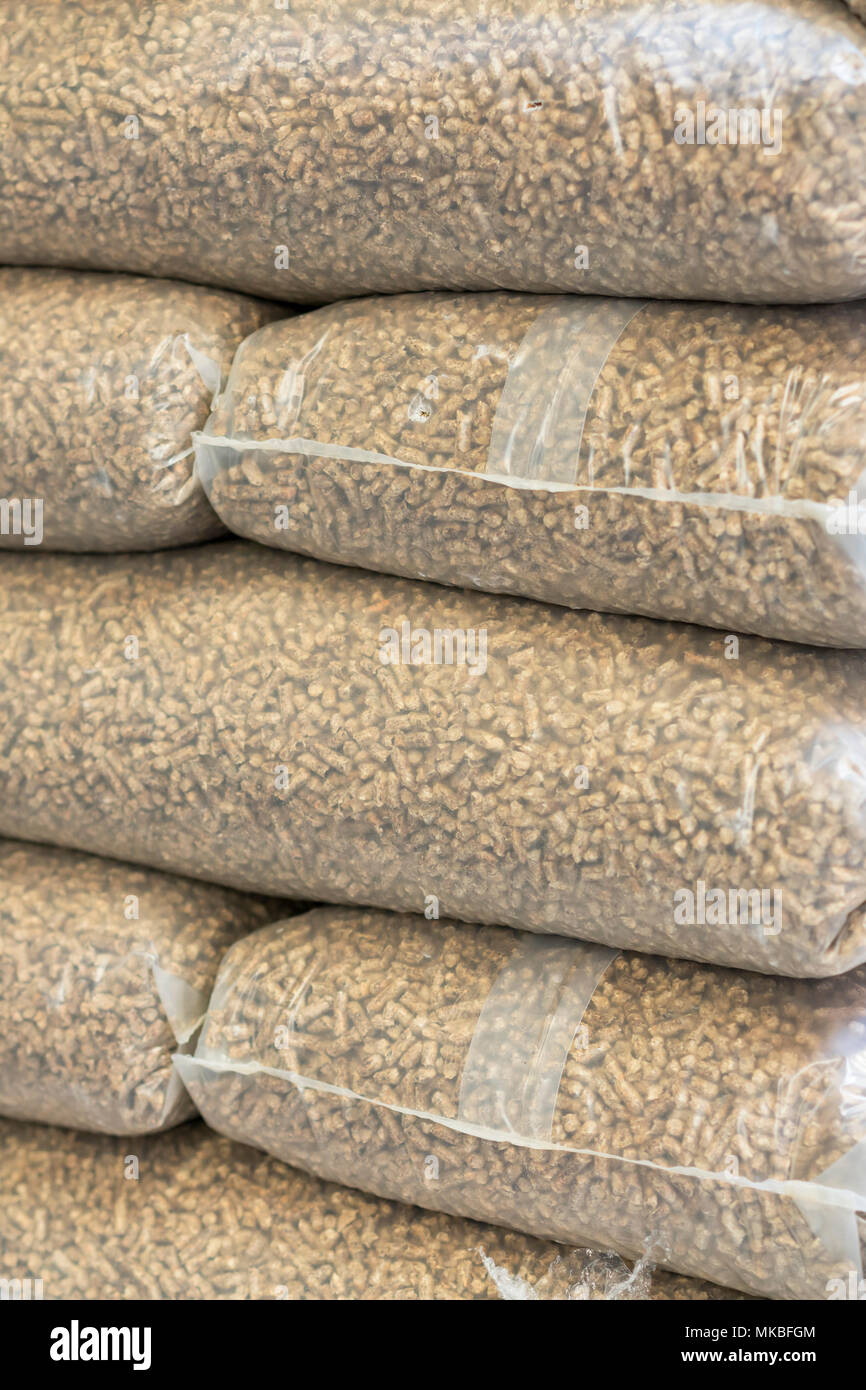 Heap of stacks of Pine pellets - stock image. Eco pellets- biomass in ...