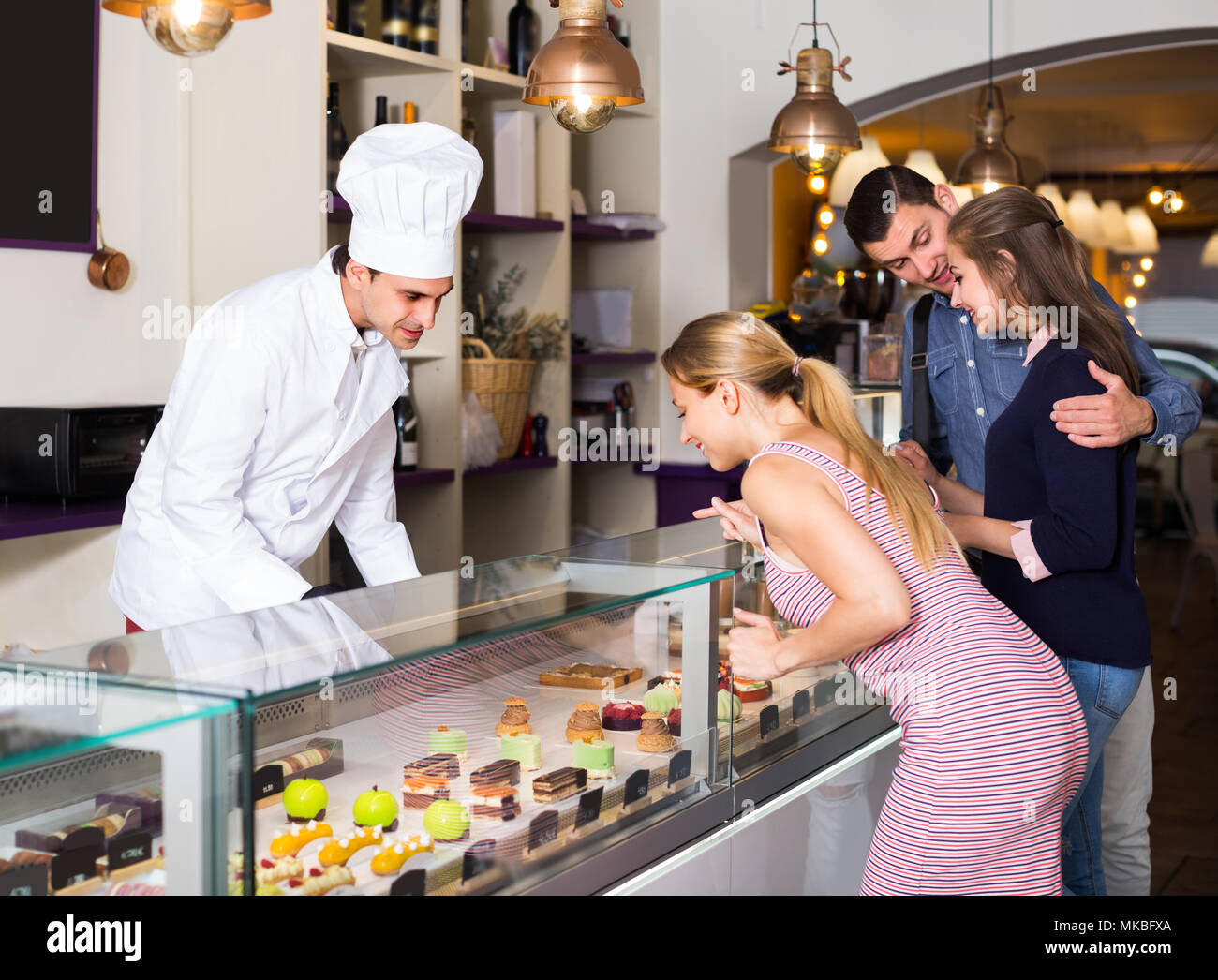Positive smiling guests cake hi-res stock photography and images - Alamy