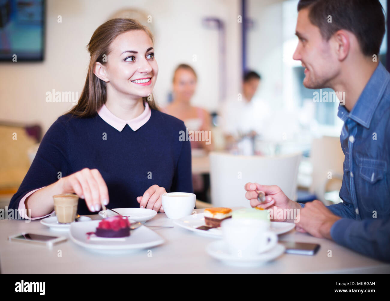 Happy couple spending time together in cozy tearoom Stock Photo - Alamy