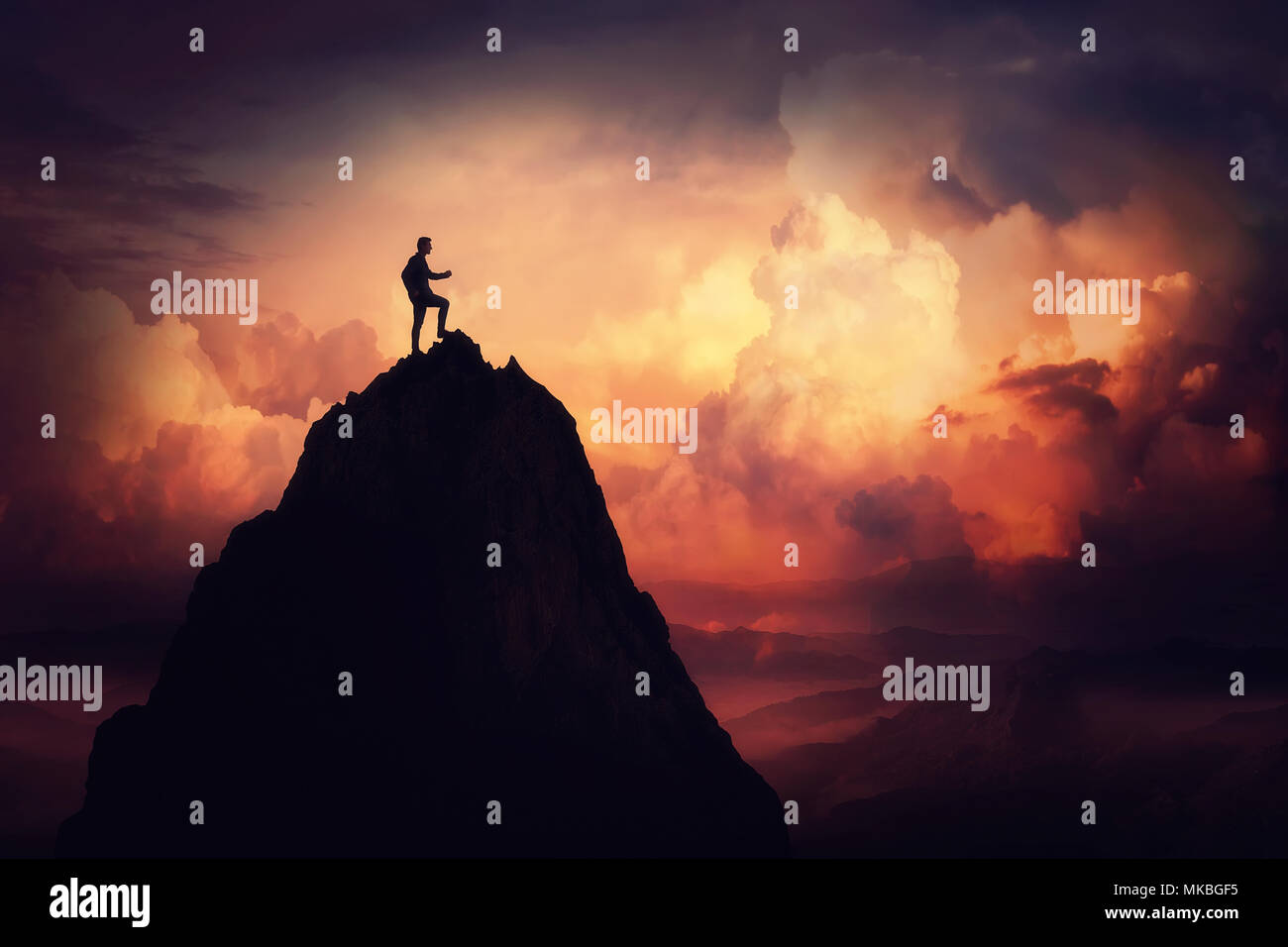 Self overcome concept as a businessman climbing a tall mountain over ...