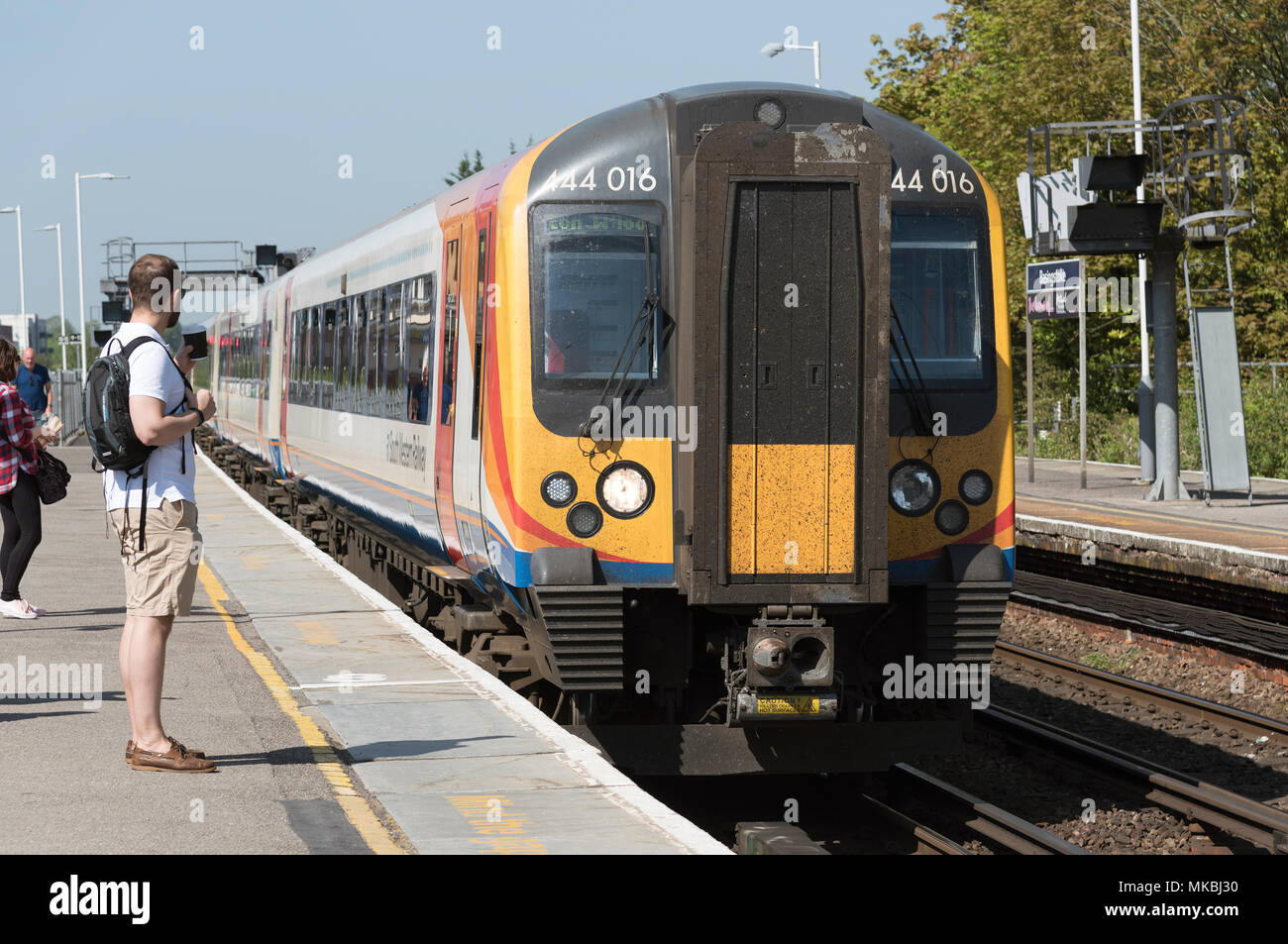 South Western Railway train and passengers at Basingstoke Station ...