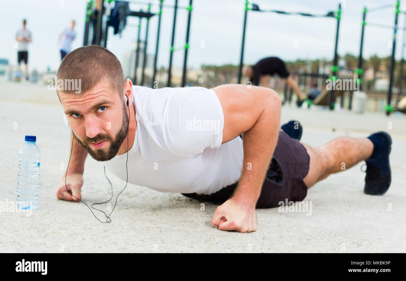 Strong man performs muscle ups hi-res stock photography and images - Alamy