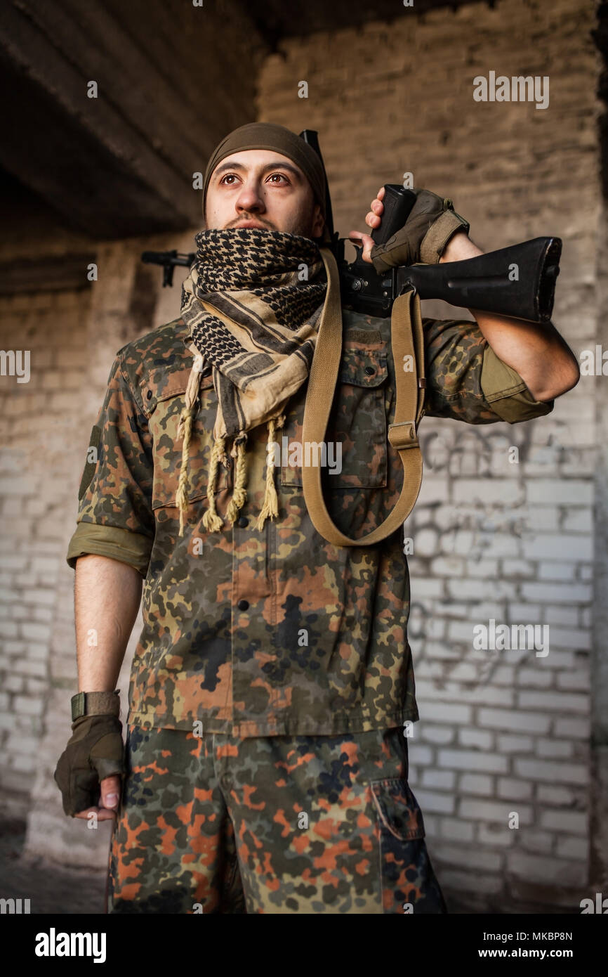 The Arab soldier with the AK-47 Kalashnikov assault rifle Stock Photo ...